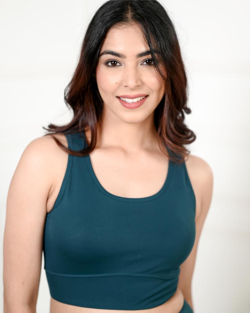 Teal sports bra for women suitable for exercise, workout, training & gym.